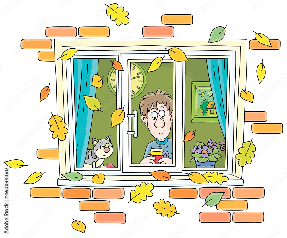 Sad boy and his funny cat looking out of a window with flying colorful ...