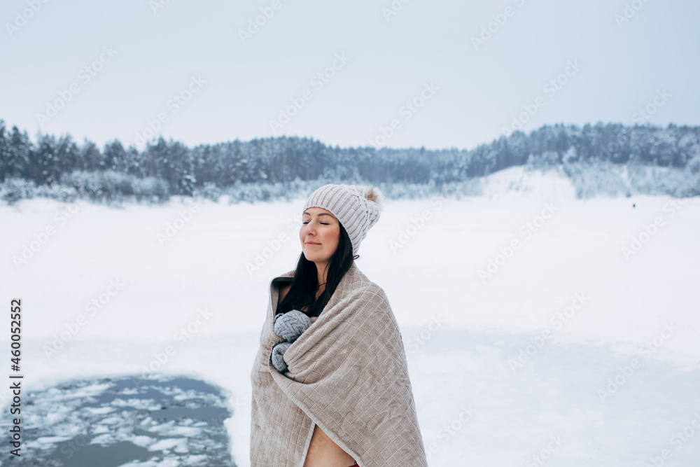 Winter swimming. Woman ready to swim in ice water. How to swim in cold ...