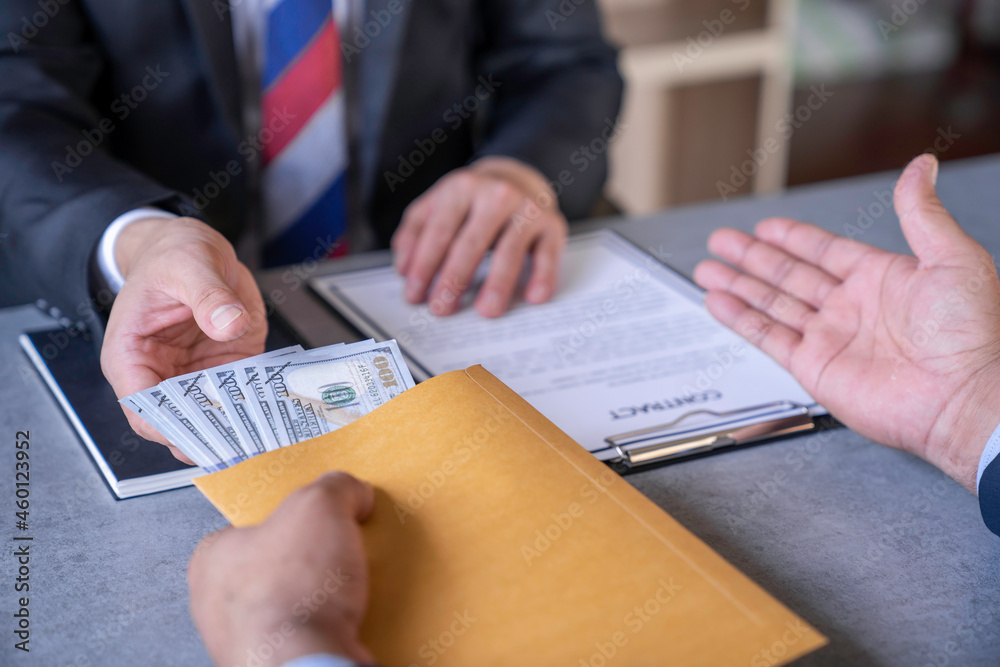 Businessmen or politicians agree to accept bribes. To do illegal ...