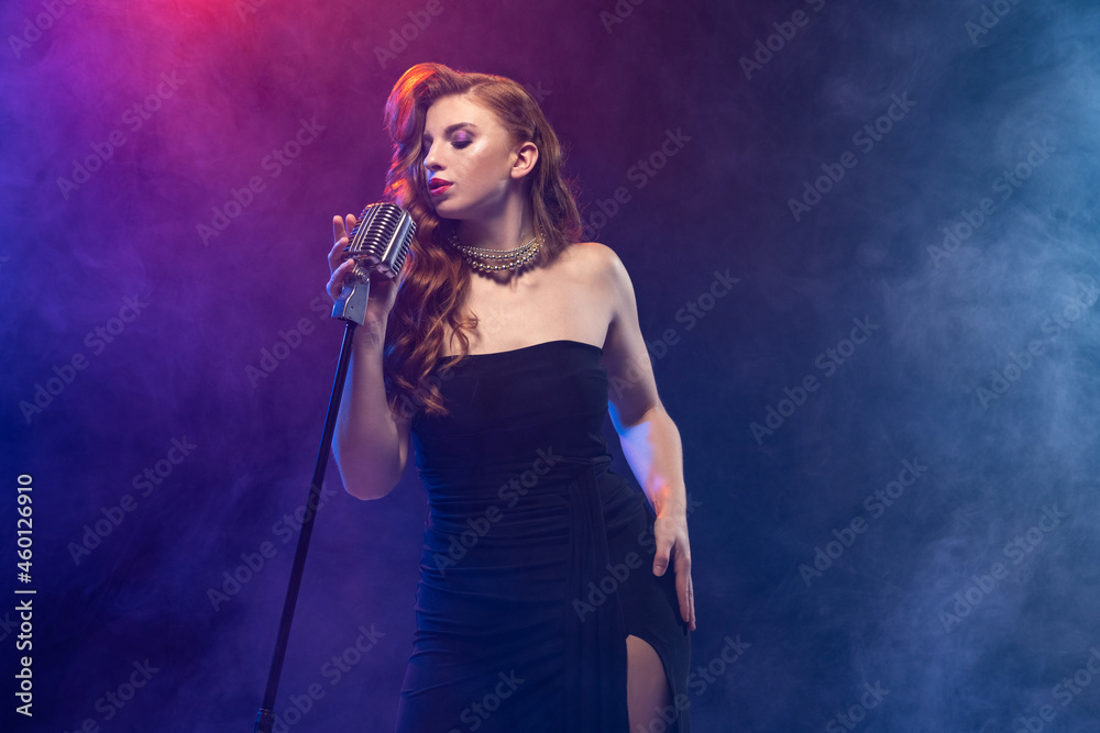 Cropped portrait of young artist, female vocalist isolated over ...