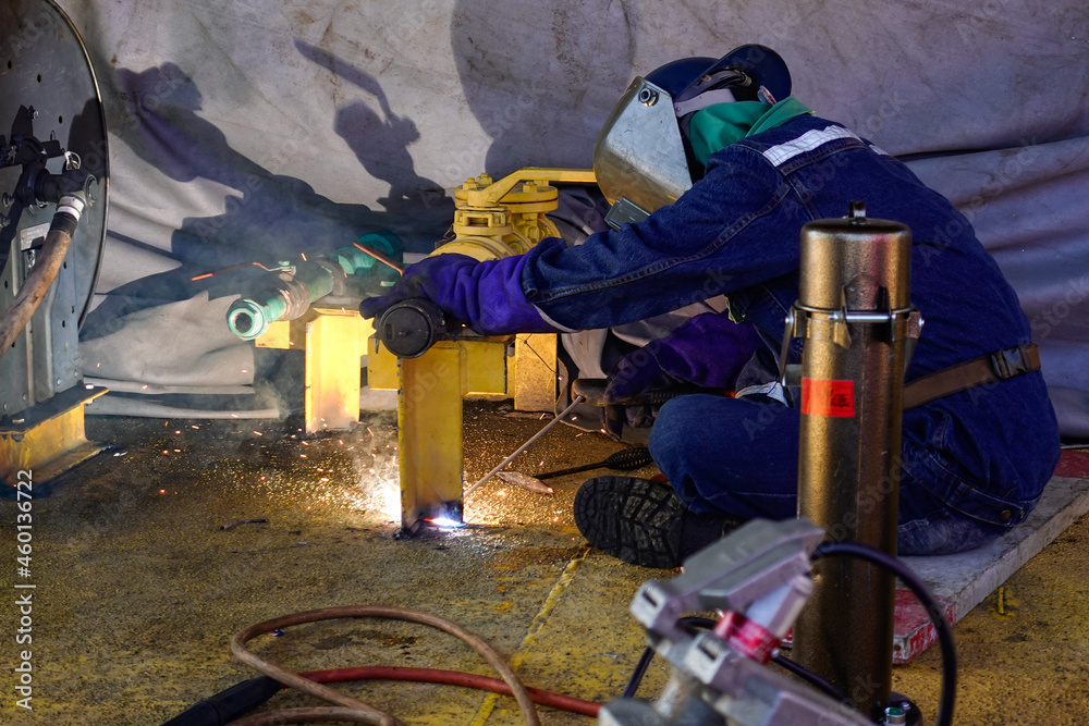 Welder weld steel structure in offshore oil and gas platform rig and ...