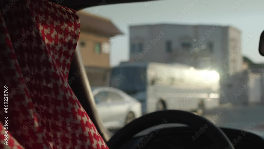 Saudi man inside the car, driving around the city wearing the ...