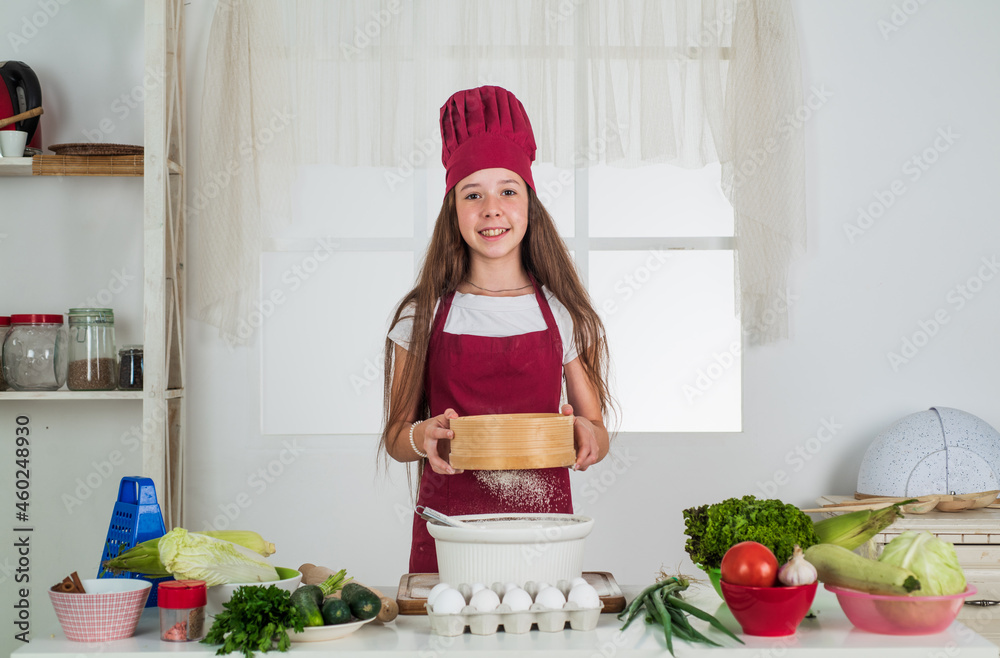 teen girl in cook uniform prepare food in kitchen, culinary Stock Photo ...