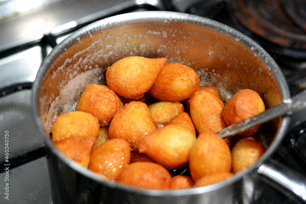 Zalabia in a stainless steel pot, a type of middle eastern fried dough ...