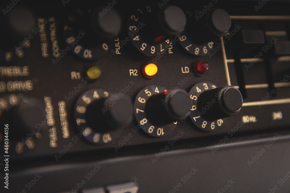 Guitar amplifier in recording studio, work on music in progress: yellow ...