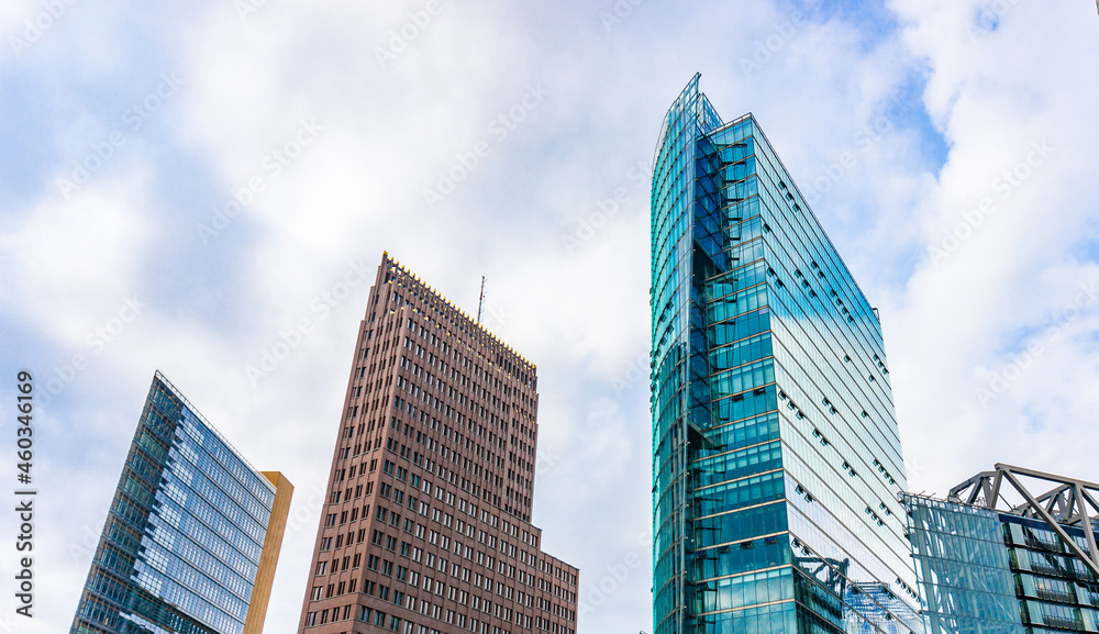 Futuristic high-rise commercial office buildings rise behind train ...