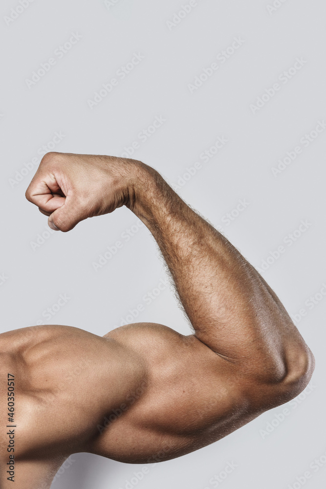 Muscular arm of young bodybuilder Stock Photo | Adobe Stock