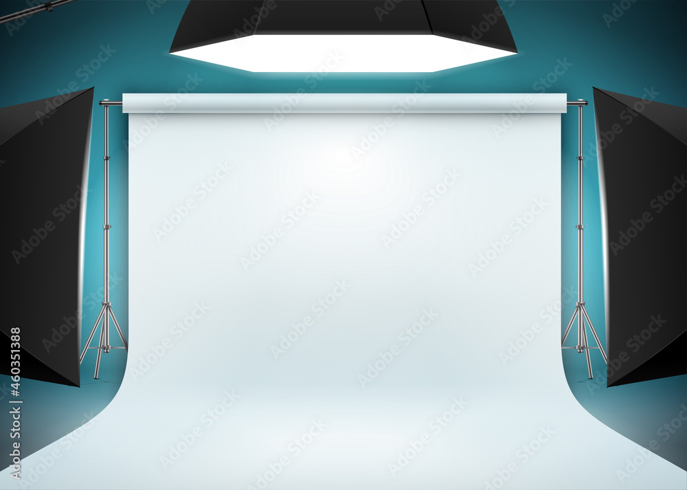 Photo studio scene with a white backdrop paper and bright studio lights ...