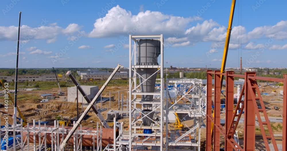 At construction site where a new, modern plant is being built, a lot of ...