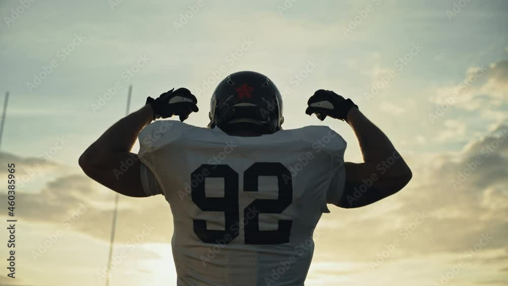 American Football Championship Game: Powerful Player Wearing Helmet ...