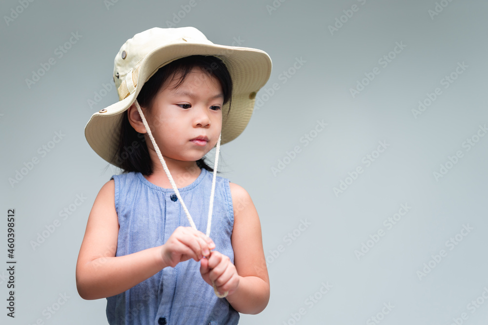 The embarrassed child was drooping. Cute girl held her hand to the end ...