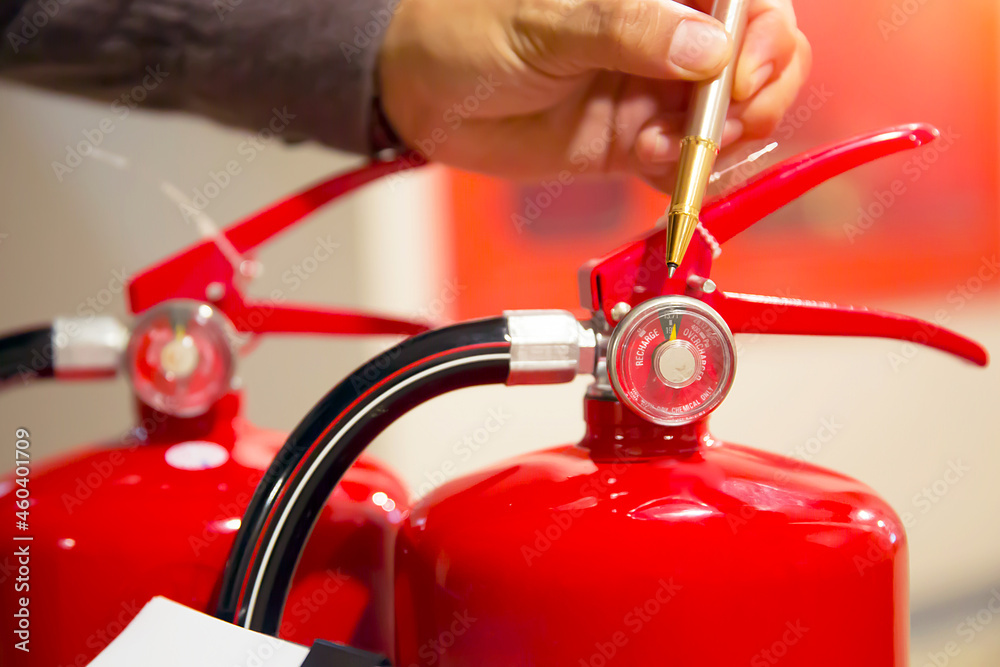 Fire extinguisher, Engineer inspection checking pressure gauge level ...