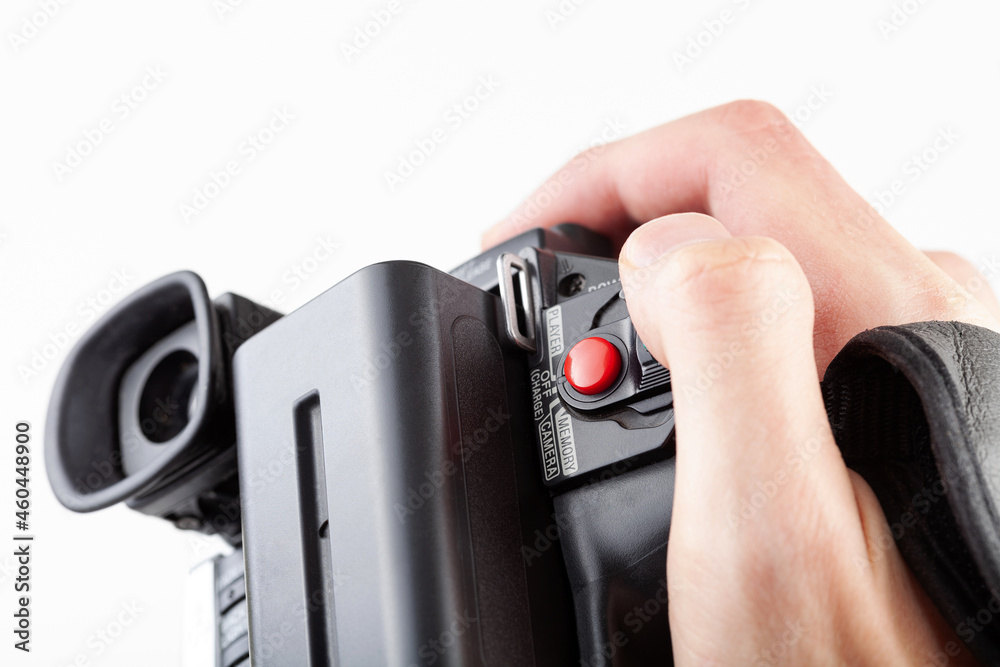 Handheld camcorder, old retro video camera object held in hand, closeup ...