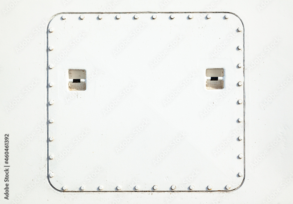White, square hatch cover on the ship's hull, closed and bolted. Stock ...