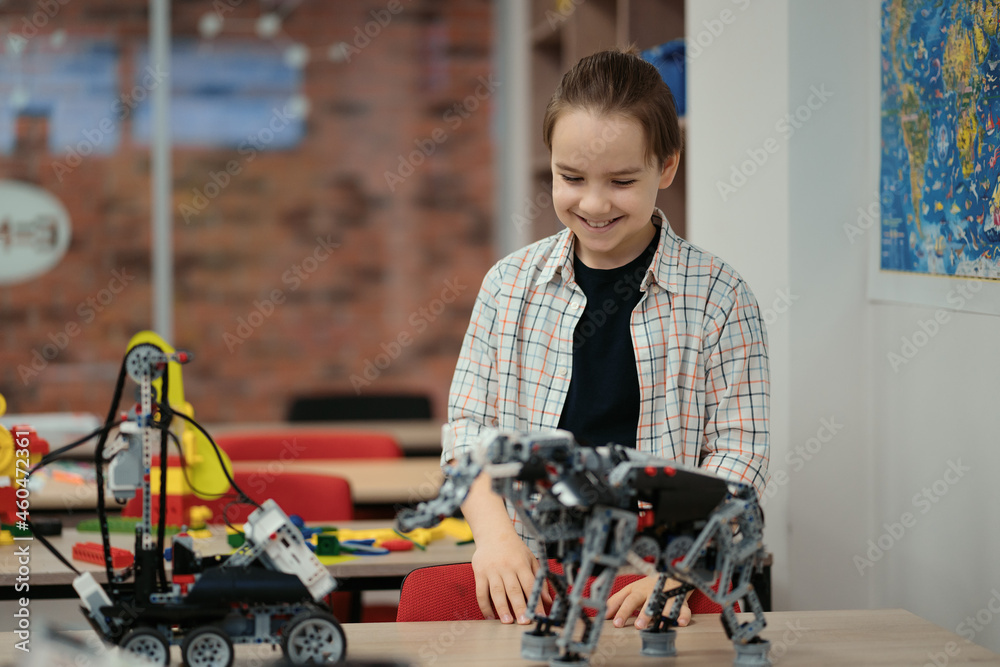 Boy Works on a Fully Functional Programable Robot for His School ...
