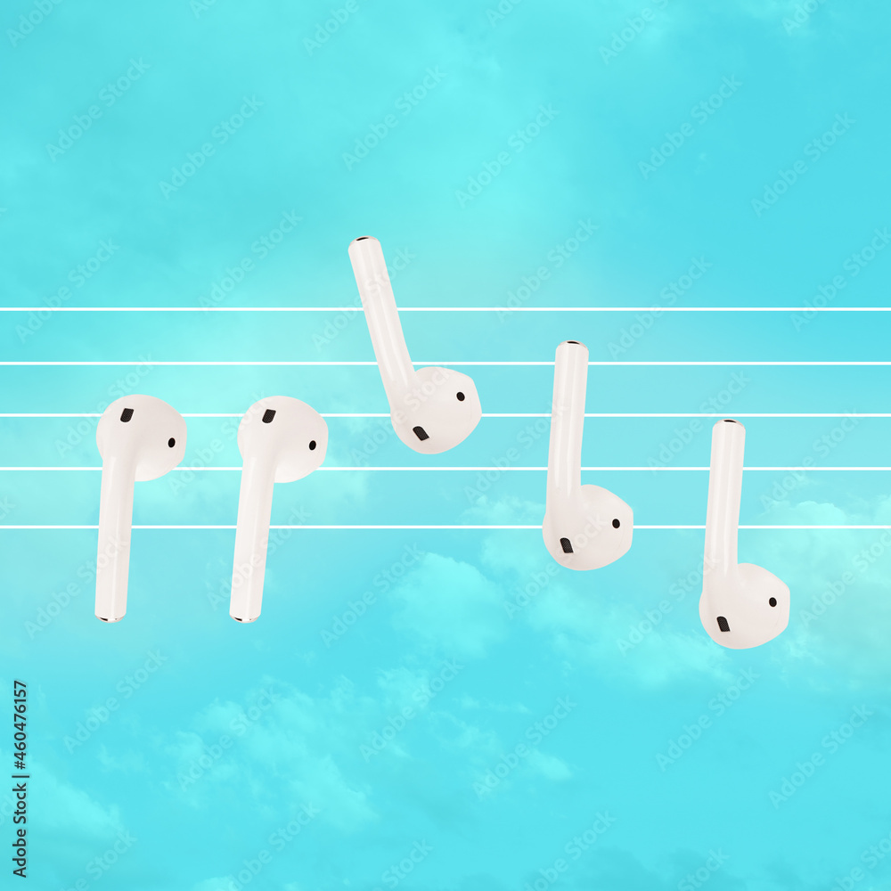 Modern wireless ear phones looks like musical notes. Music listening ...