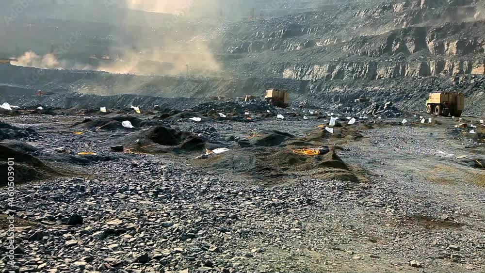Preparing a quarry for an explosion. Placing a charge in the soil for ...