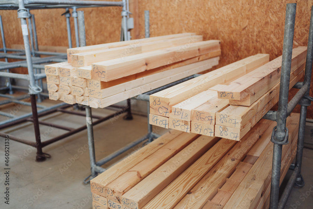 Racks of planed and processed timber planks or beams in factory Stock ...