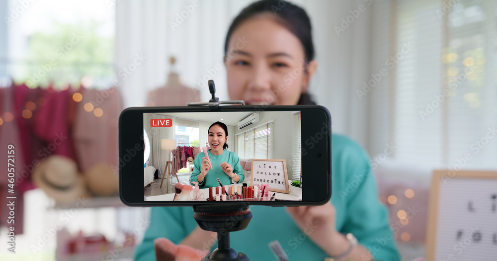 Asia woman micro influencer record live viral video camera at home ...