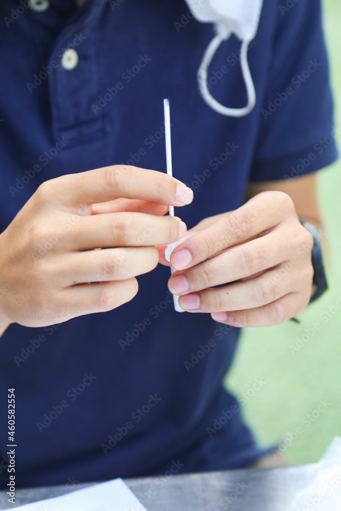 People swab COVID-19 testing by Rapid Antigen Test kit before working ...