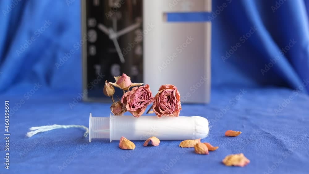cessation of menstruation - menopause. dried red rose lies on a woman ...