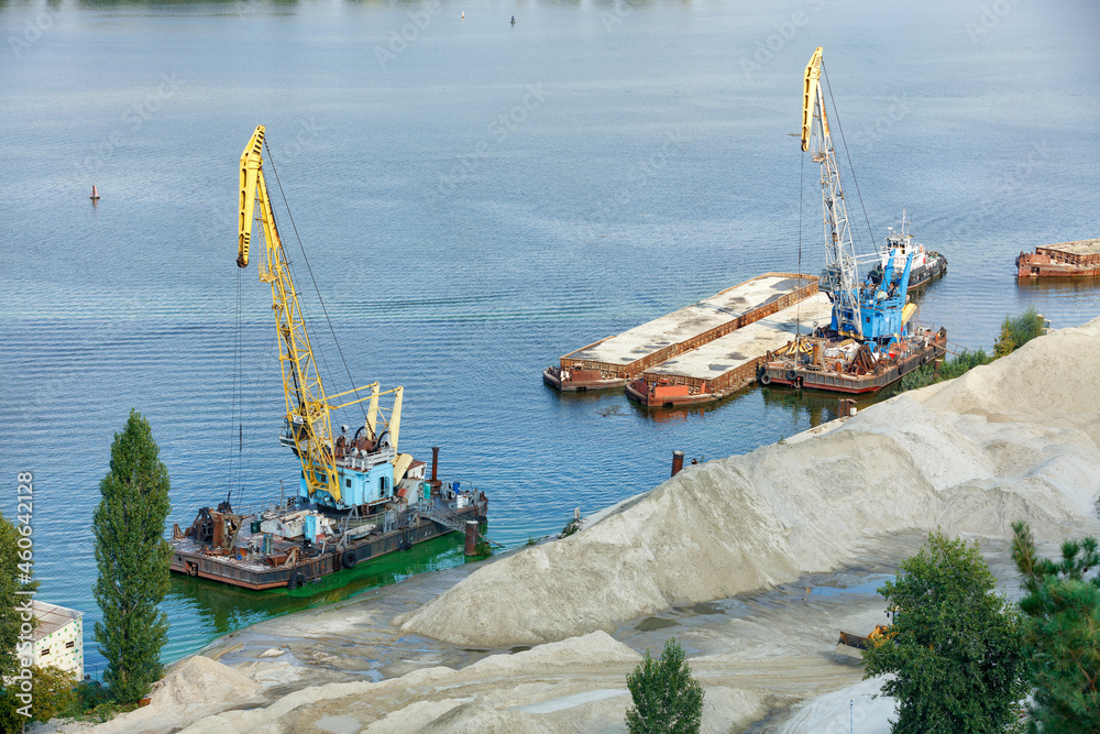 River industrial transport and equipment. Floating industrial cranes ...