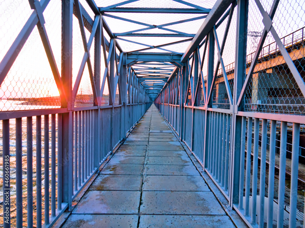 Bridge crossing, pedestrian overpass made of metal structures over the ...