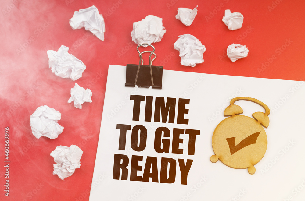 On a red background in smoke, crumpled paper and a sheet with the ...