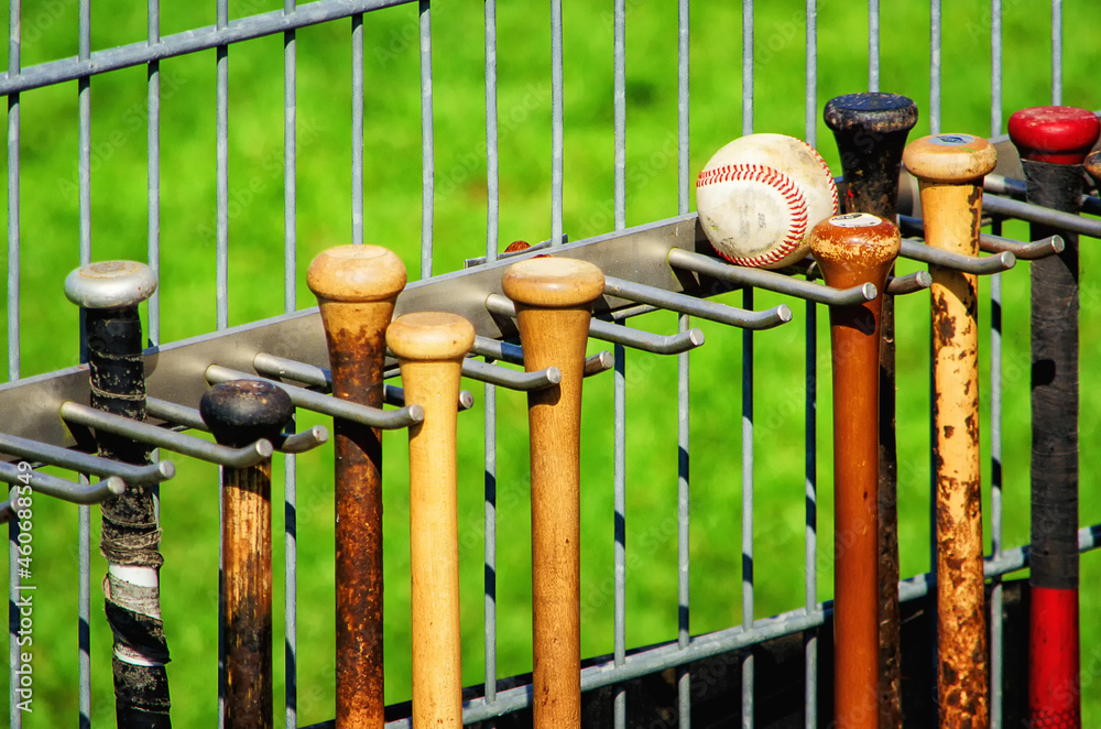 Hanging baseball bat, Baseball bats hanging on the racket holder ...