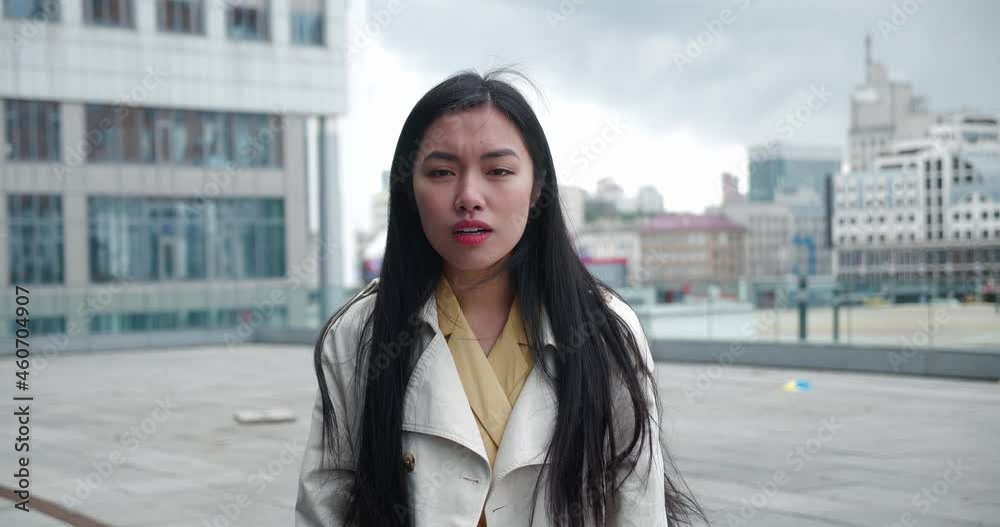 Scared shocked asian young woman man looking camera see something ...