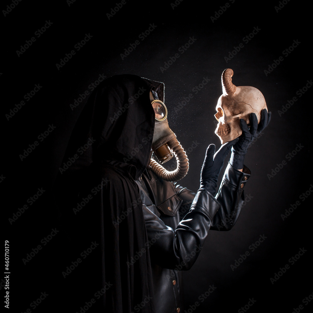 Post-apocalyptic world, concept. A gloomy servant of the devil cult in ...