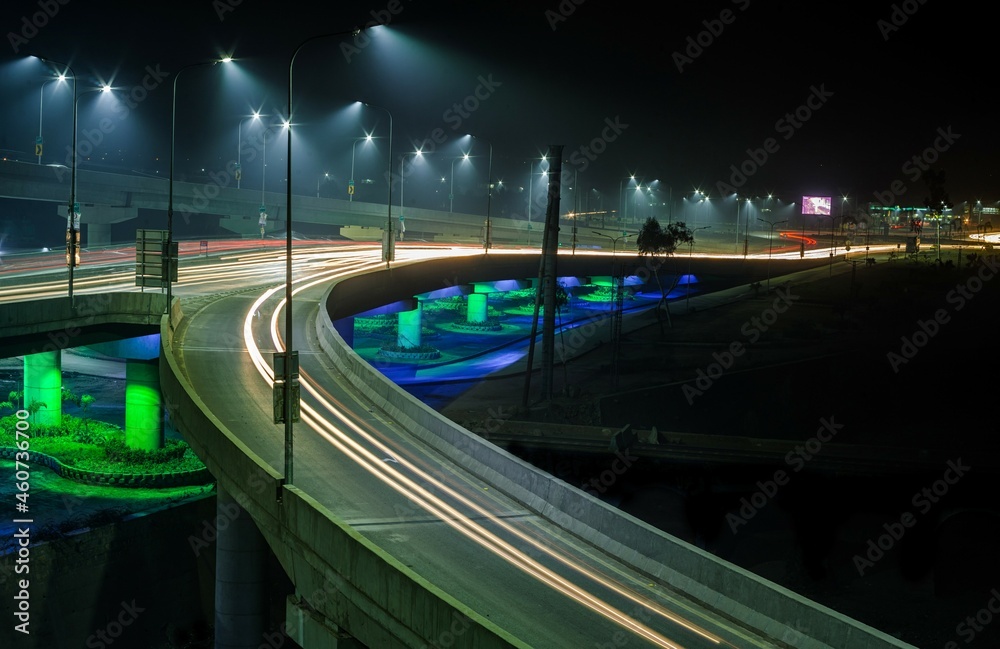Long exposure photography of flyover in with traffic moving on it and ...