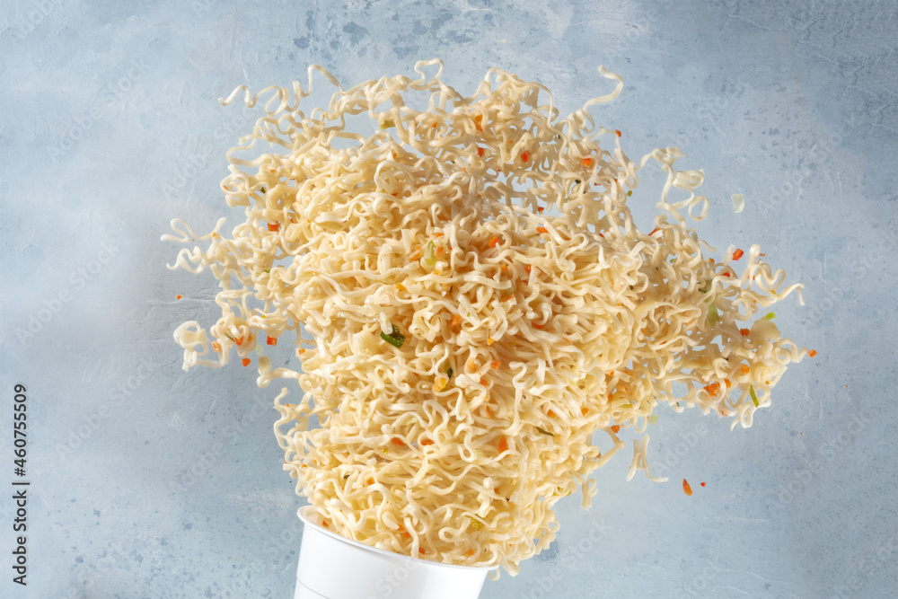 Instant noodles flying out of a plastic ramen cup, noodle tornado Stock ...