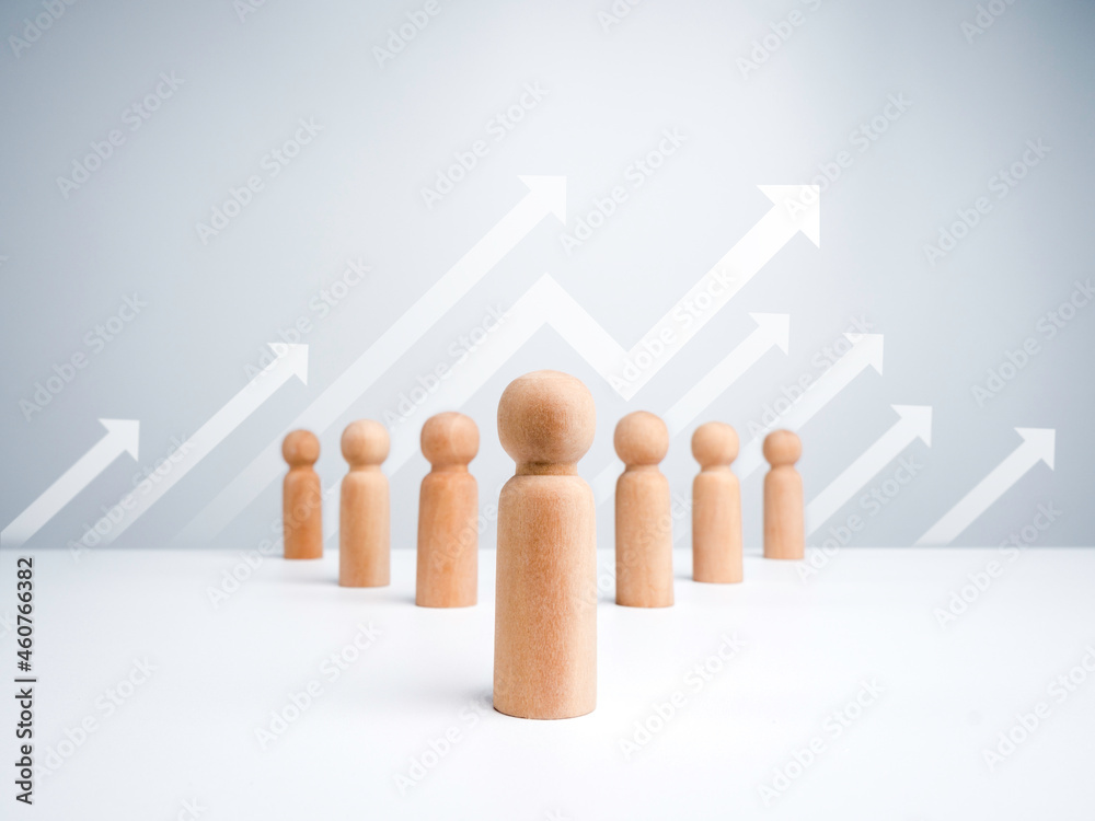 Leader wooden figures with followers lineup in orderly on white ...