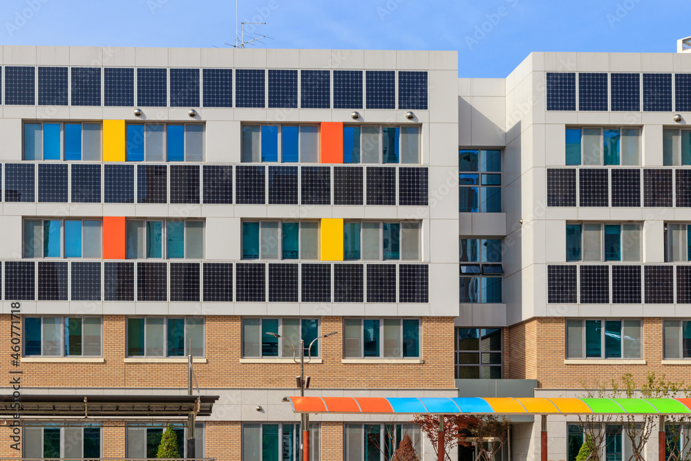 Building solar panels. Solar elementary school building. Eco-friendly ...