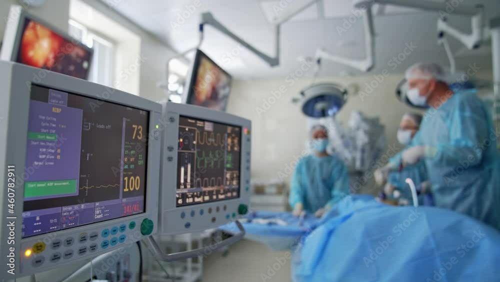 Modern medical operation room with monitor. Graphic lines on the screen ...