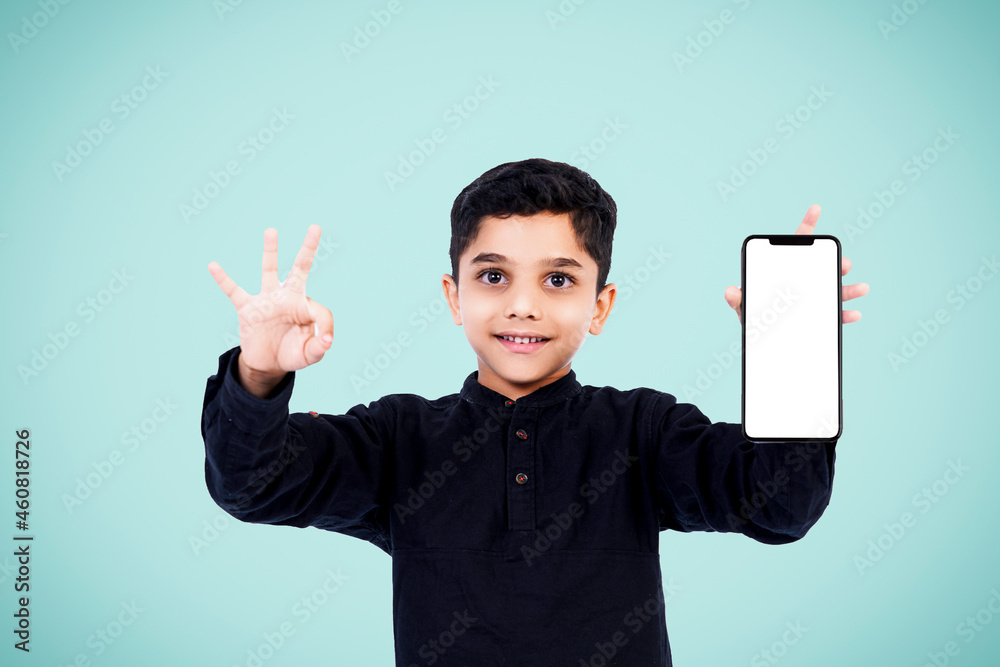 Indian little boy with smart phone Stock Photo | Adobe Stock