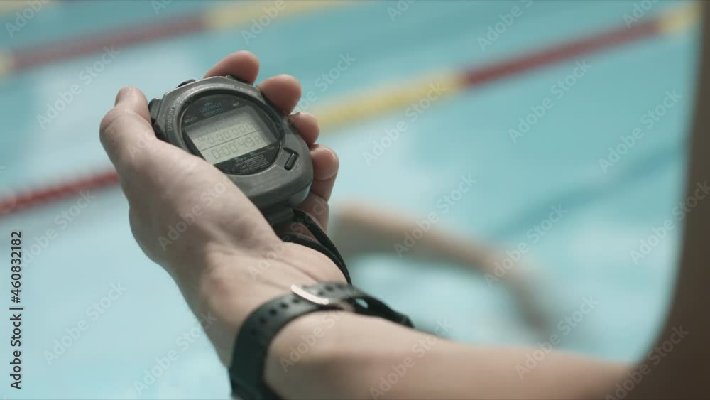 Video „Close-up shot of a Caucasian male hand holding a stopwatch ...