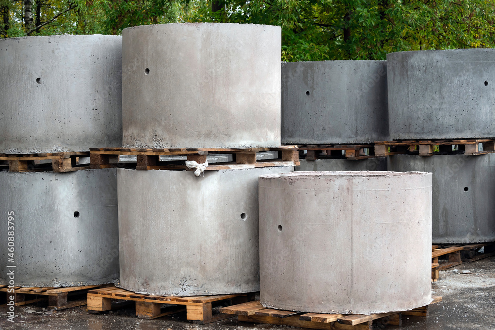 Reinforced concrete rings of a well or sewer in outdoors. Industrial ...