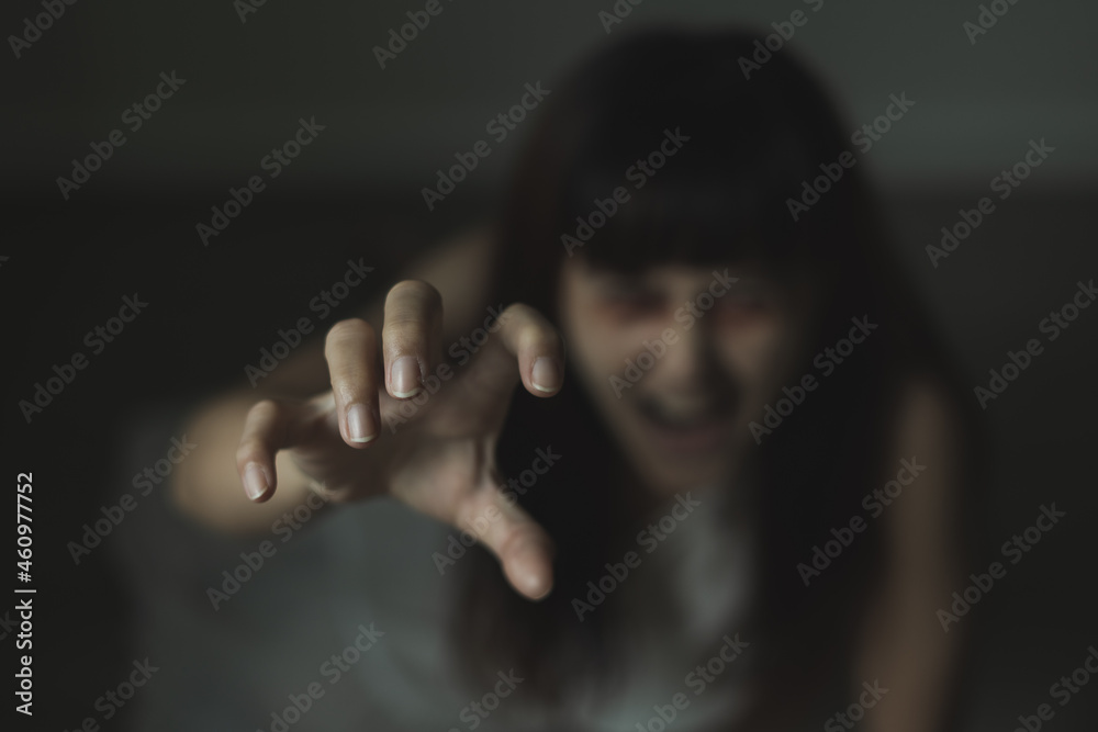 Female ghost in white dress in room. A young scary girl in an old white ...