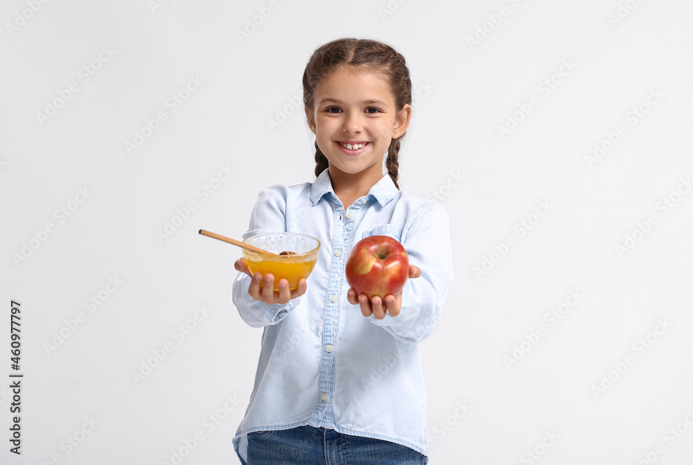 Little girl with honey and apple on white background. Rosh Hashanah ...