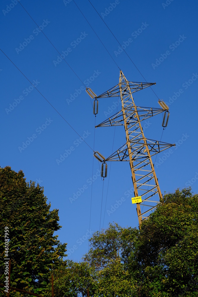 High voltage pylon. High voltage electric pylon.Power line with another ...