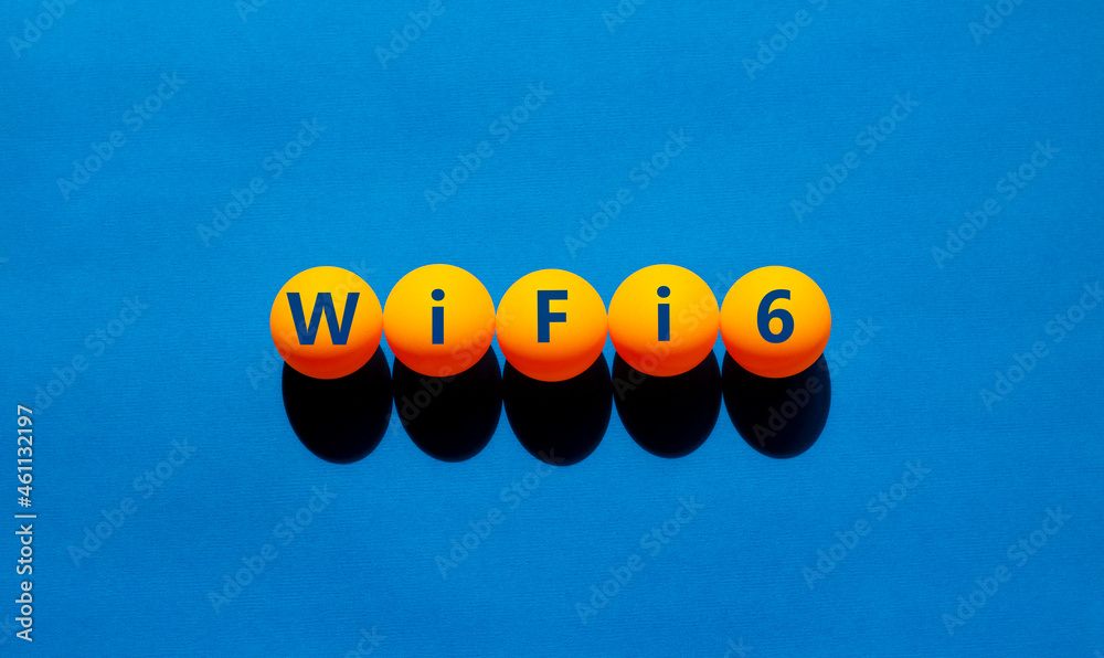 WiFi 6 symbol. The concept word WiFi 6 on orange table tennis balls ...