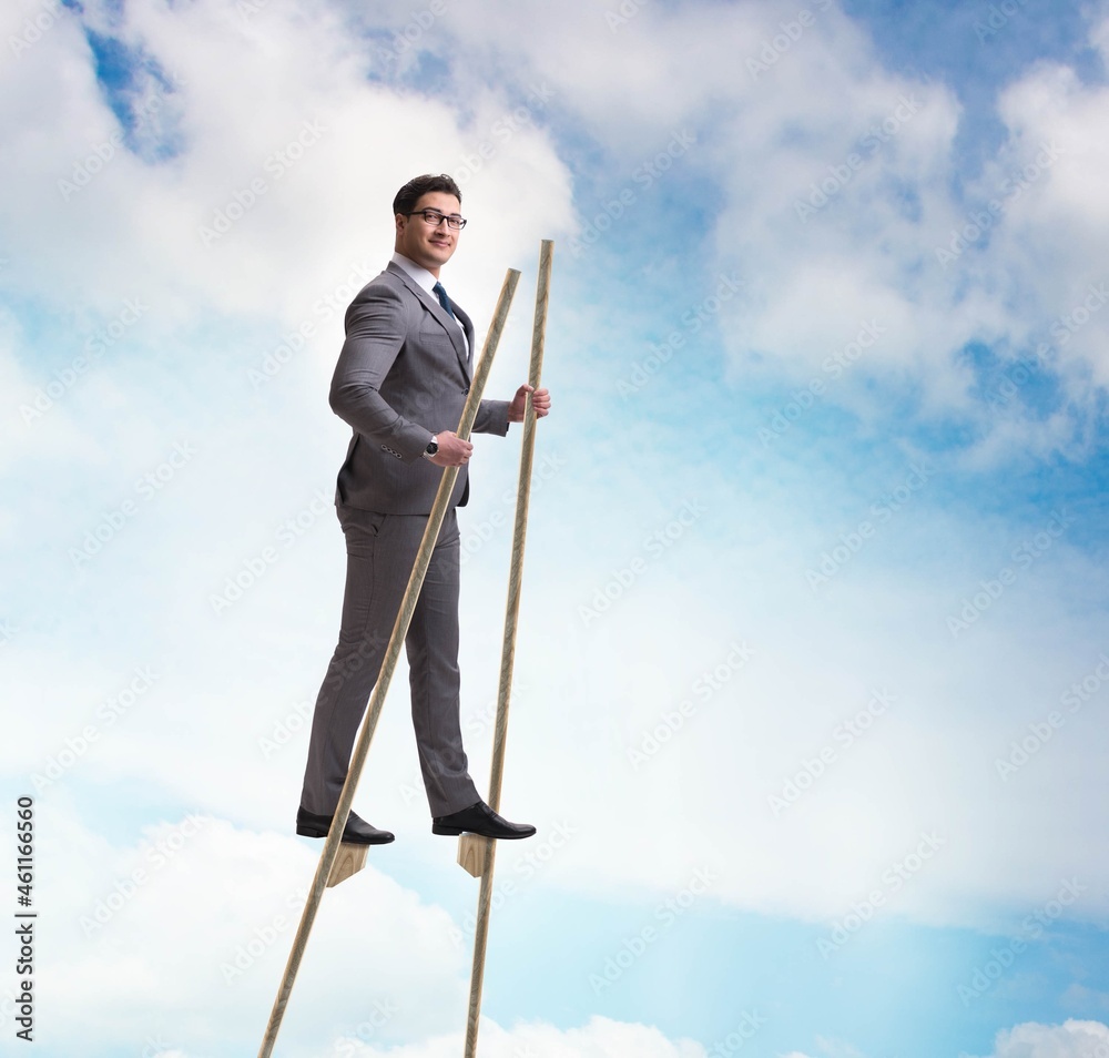 Póster Businessman walking on stilts - standing out from the crowd ...
