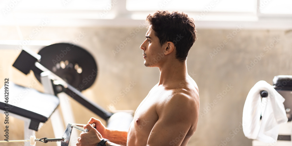 Handsome young shirtless Asian man practicing muscle training and ...