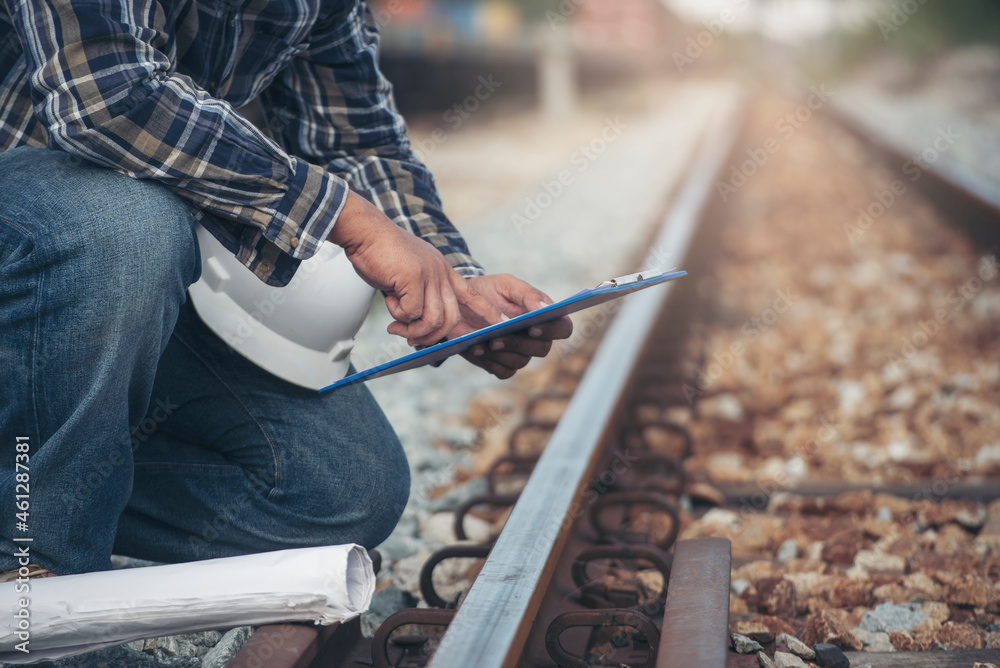 Asian engineer men fill out form or inspect in front of construction ...