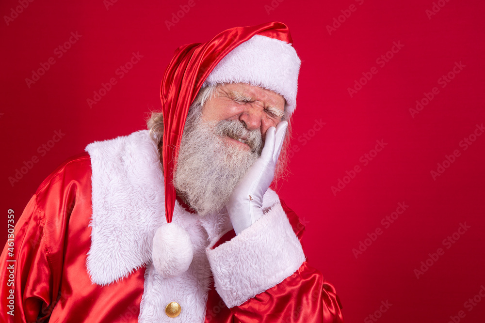 Santa Claus with hand over mouth with pained expression because of ...