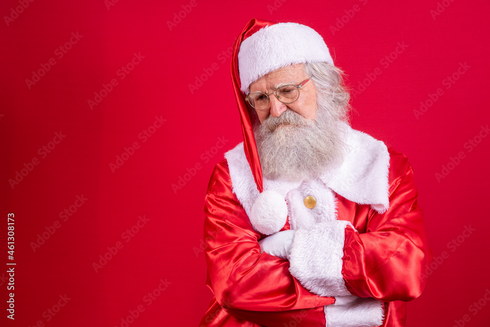 Santa Claus is sad and depressed over red background, wearing glasses ...