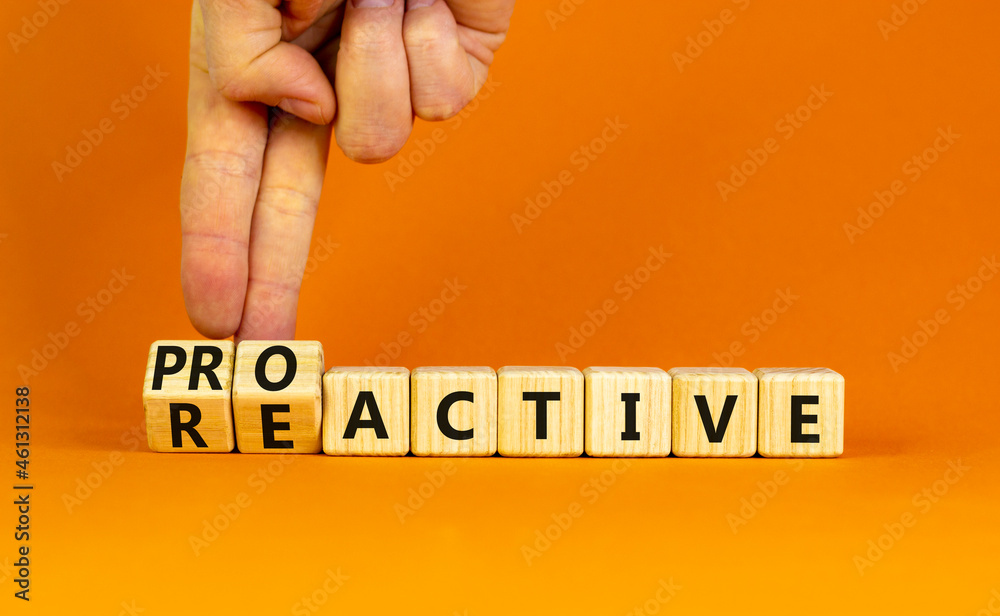 Reactive or proactive symbol. Businessman turns wooden cubes and ... Reactive or proactive symbol. Businessman turns wooden cubes and ...
