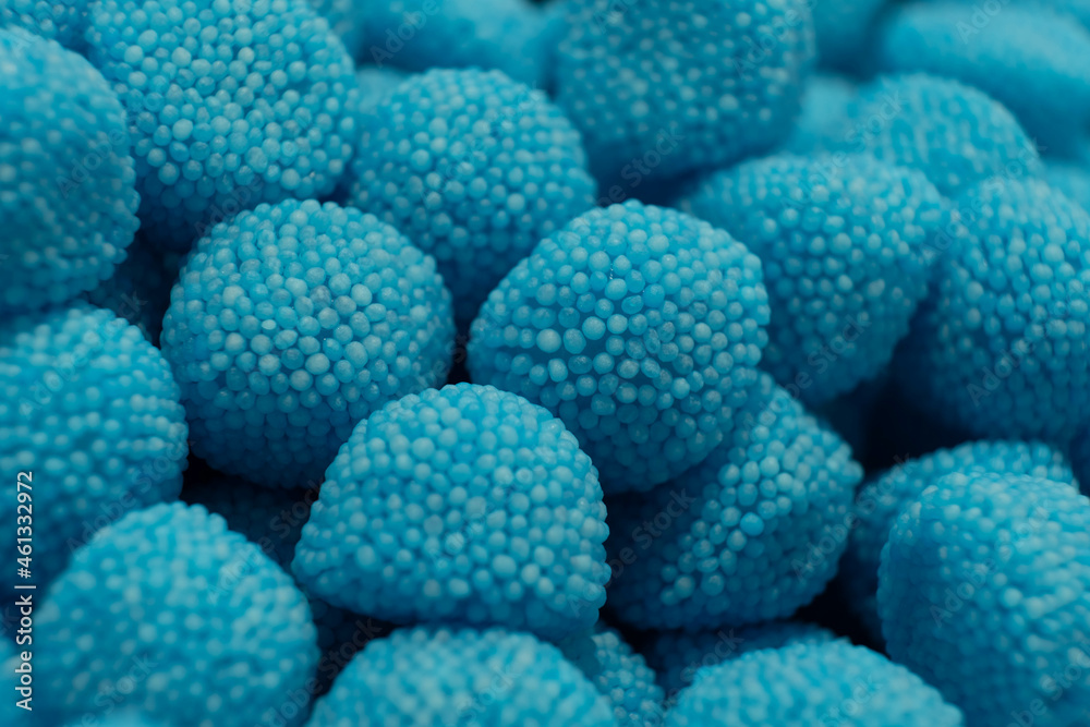 Sweet jelly look like blue raspberry and candies with sugar. Macro ...